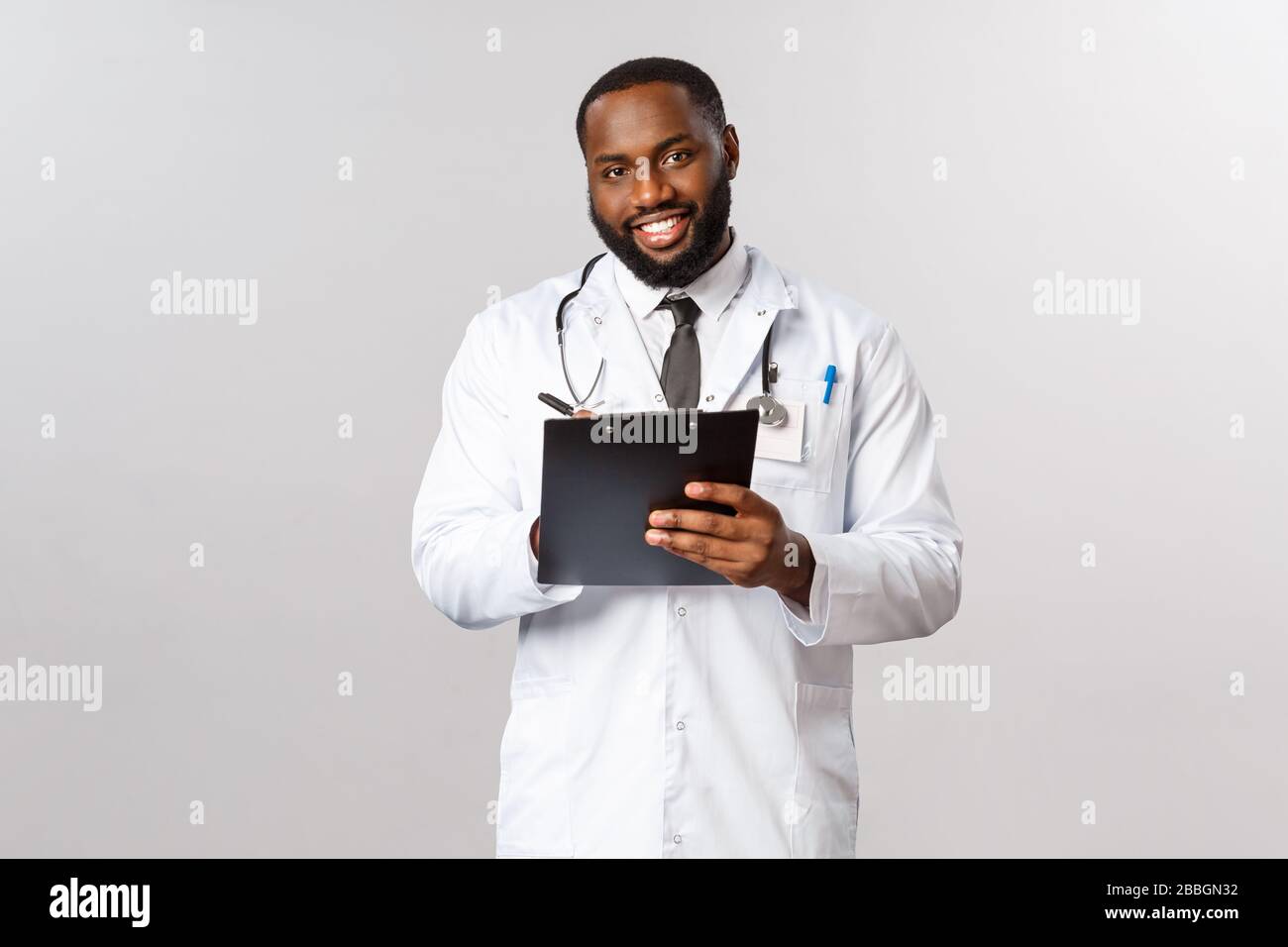 Medicine, covid19, treatment and hospital concept. Handsome african ...