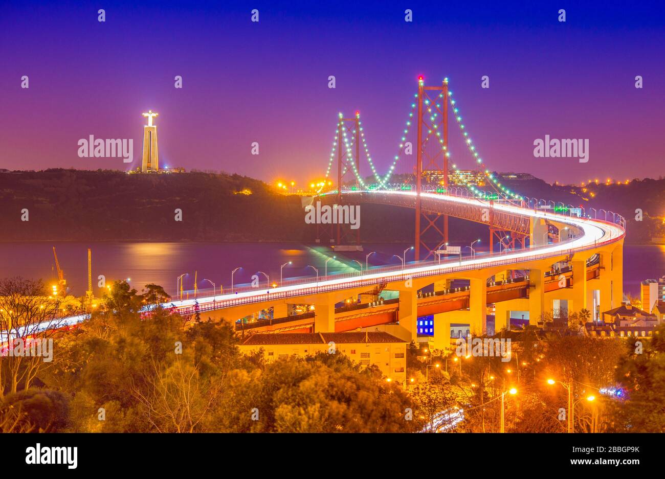 The 25th April Bridge (Ponte 25 de Abril) at night. Lisbon, Portugal ...