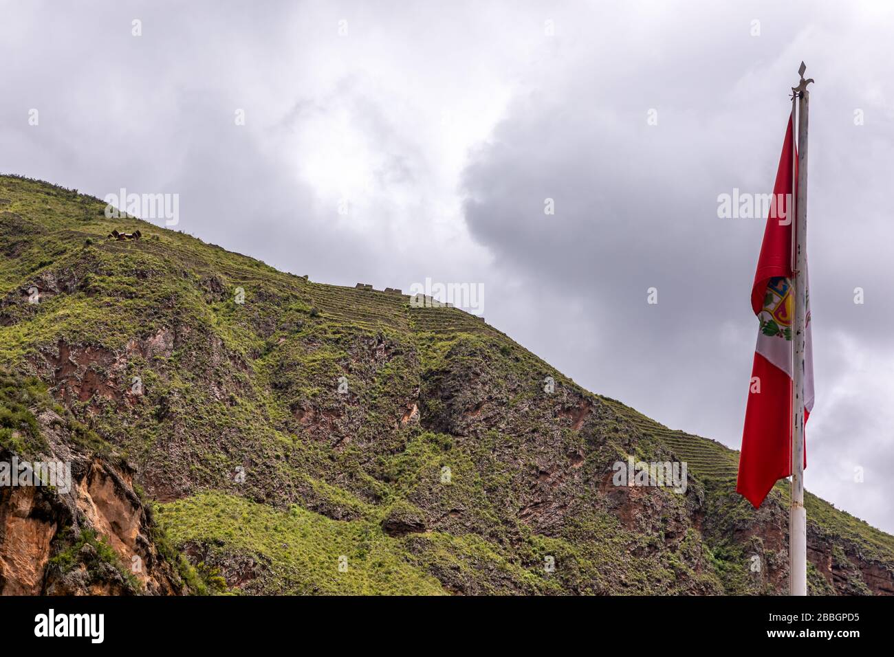 Close-up of Peru national flag with some inca ruins of Pisac (Sacred ...