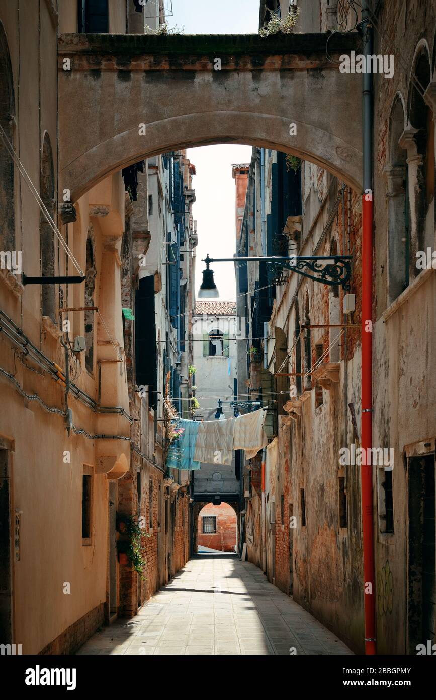 Alley view with arch and historical buildings in Venice, Italy Stock ...