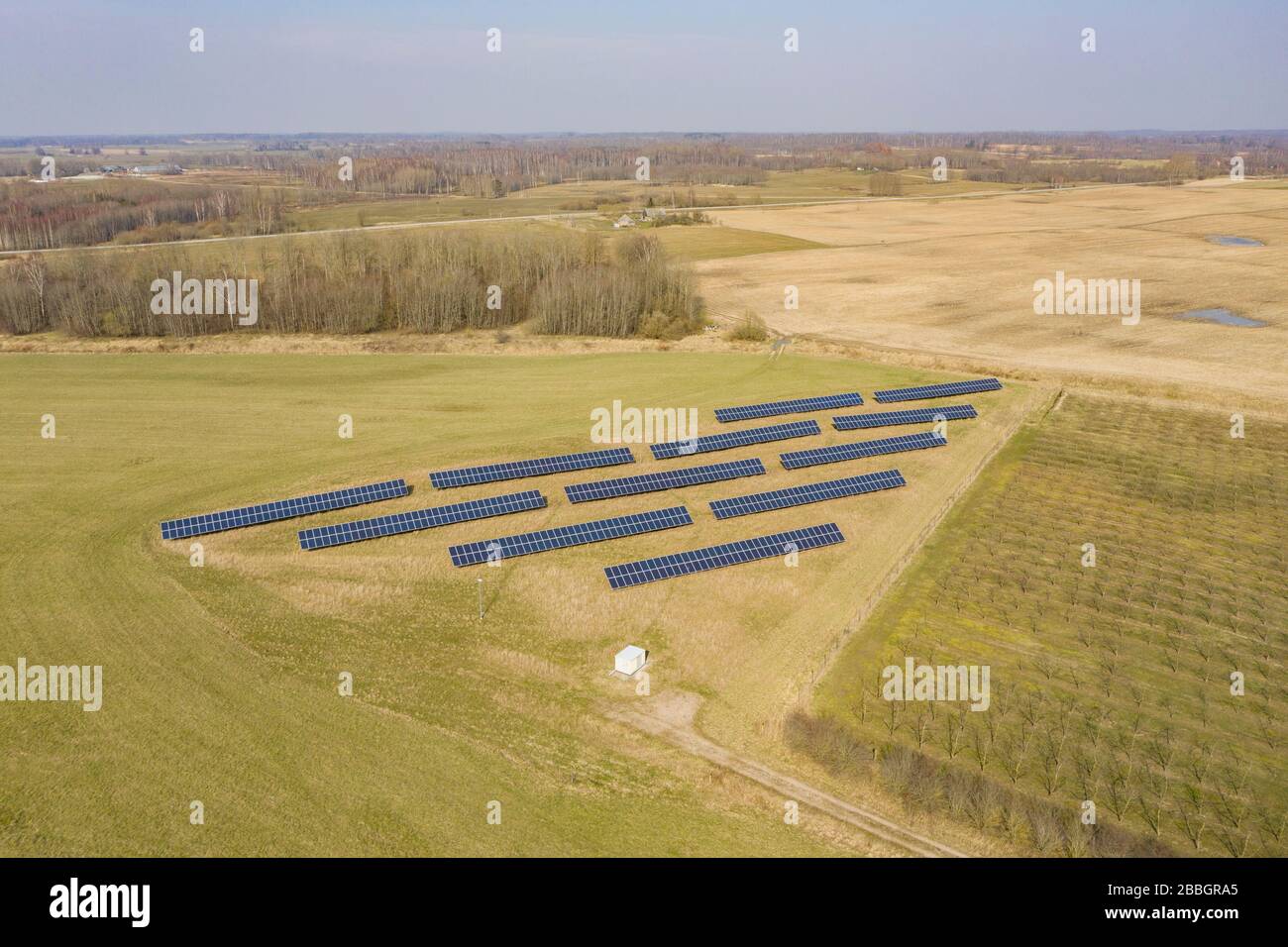 Aerial view of small solar panel farm power plant on green fields Stock ...