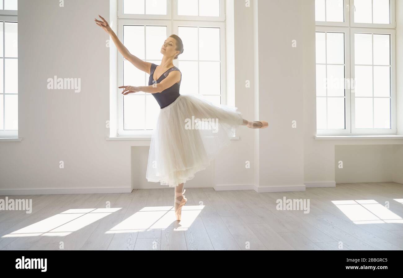 Ballerina. Young graceful ballet dancer is rehearsing a performance in ...