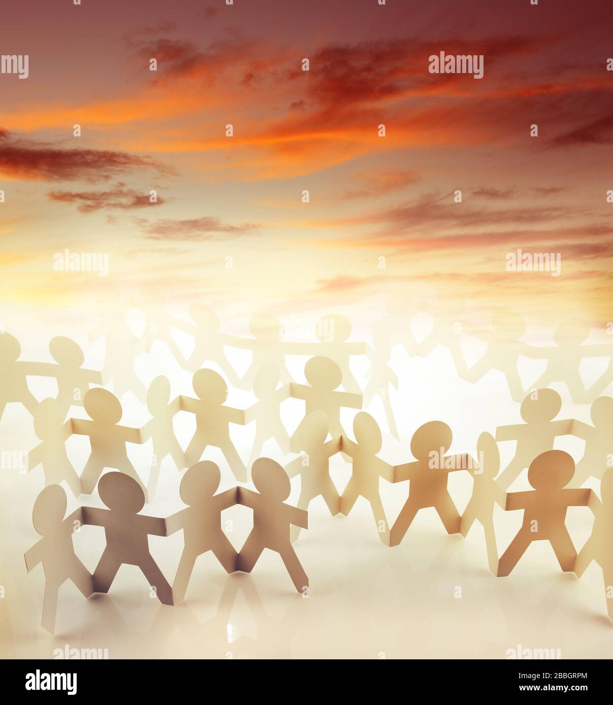Paper chain team holding hands and sky. Teamwork. Partnership Stock ...