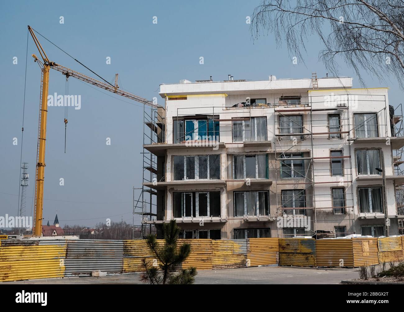 construction of a block of flats with a crane and a building Stock ...