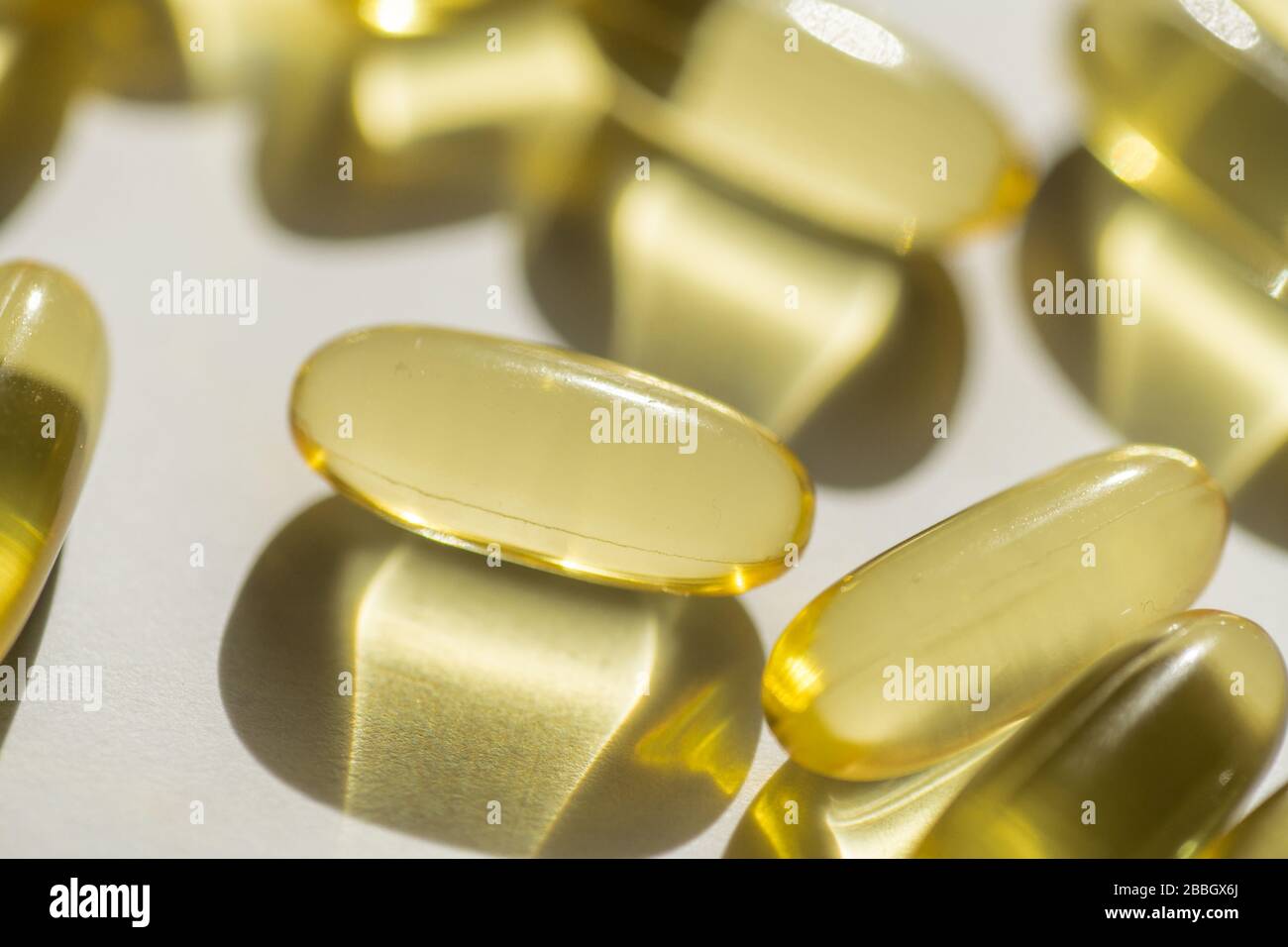 Close up capsules of fish fat oil , omega 3, vitamin Healthy food diet ...