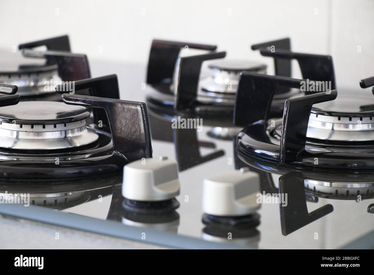 Kitchen gas stove with mirror surface Stock Photo - Alamy