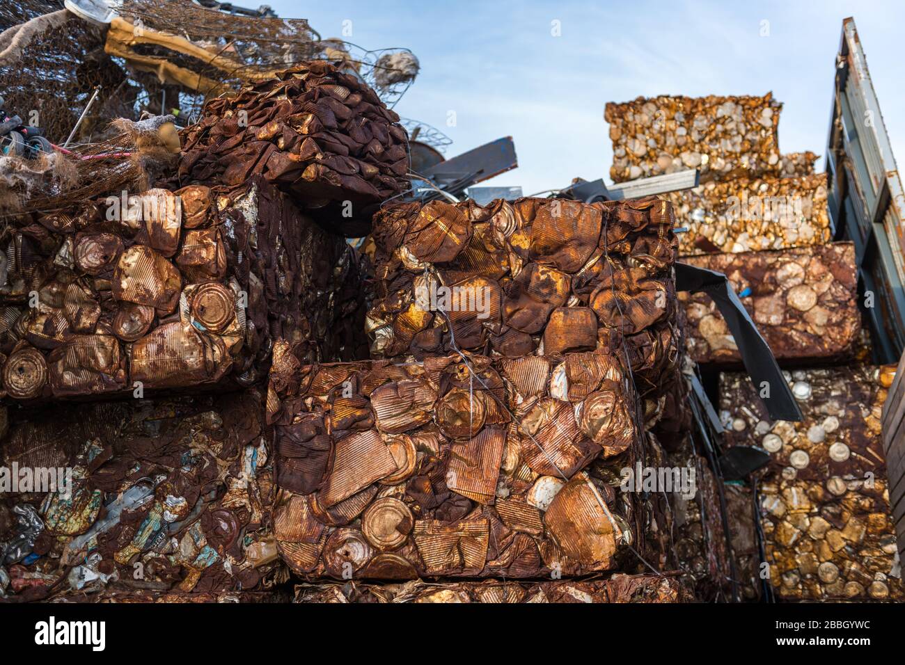 Cubes of rusty cans pressed and stacked in a junkyard Stock Photo - Alamy
