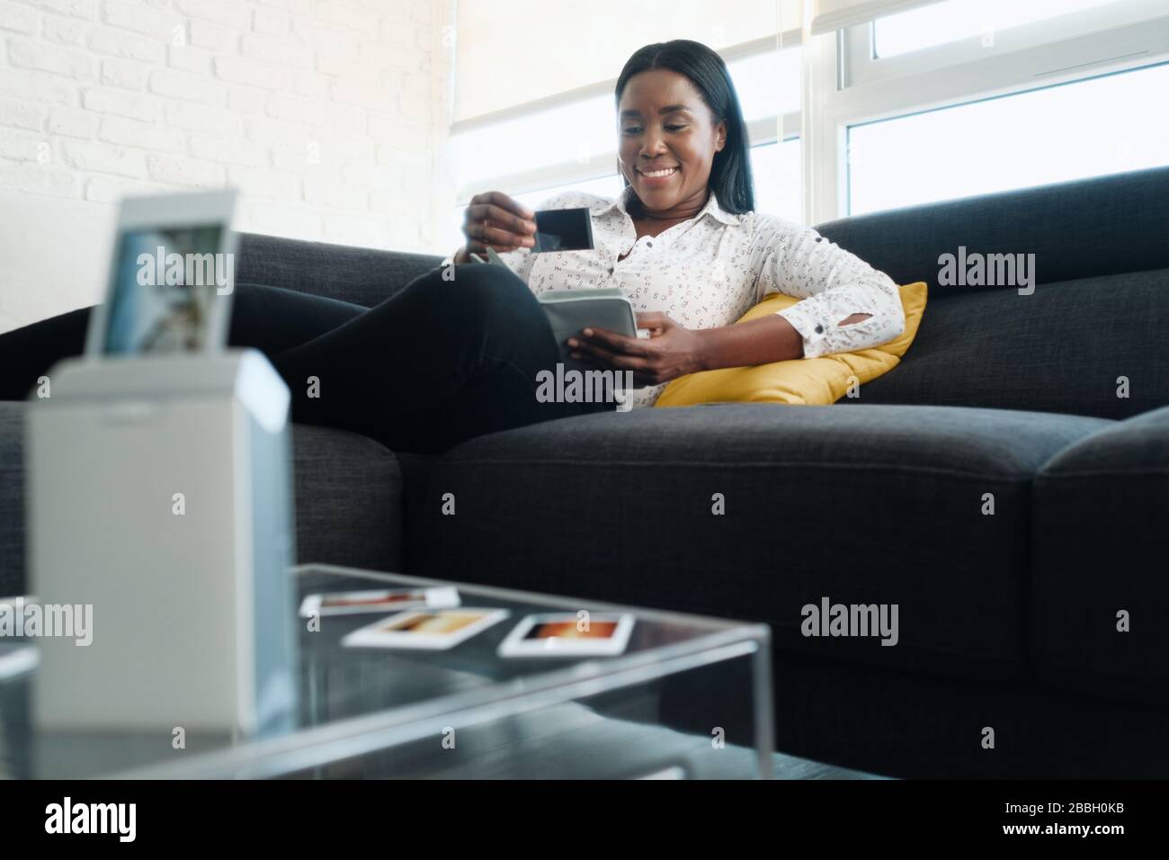 Black Woman Using Portable Wi-Fi Printer For Printing Pictures Stock ...