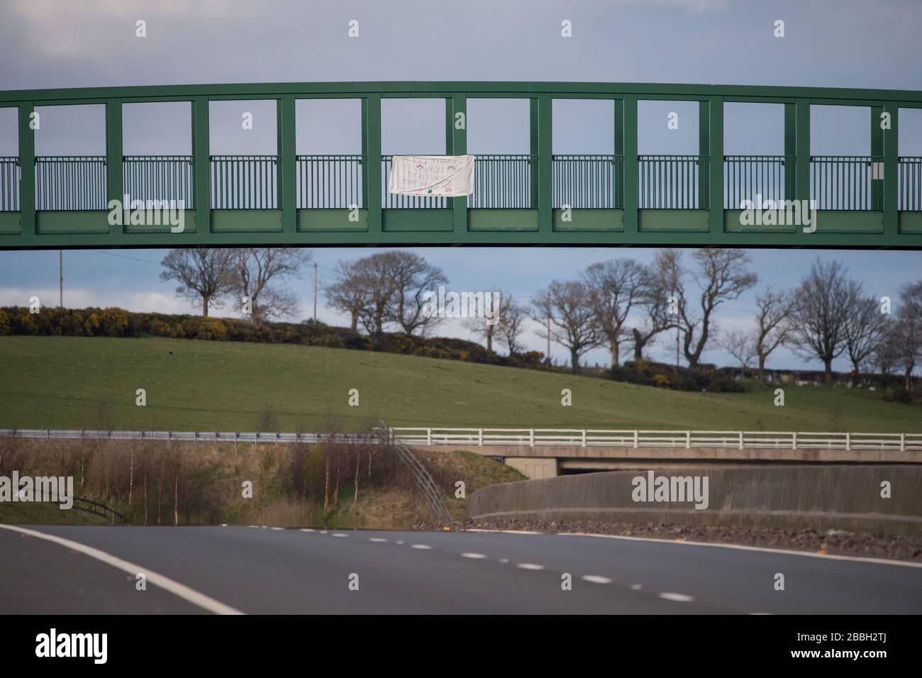 Home made sign hanging from pedestrian footbridge hi-res stock ...