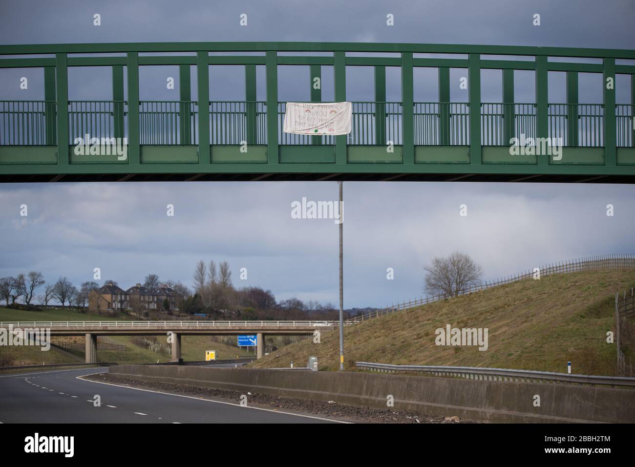 Home made sign hanging from pedestrian footbridge hi-res stock ...