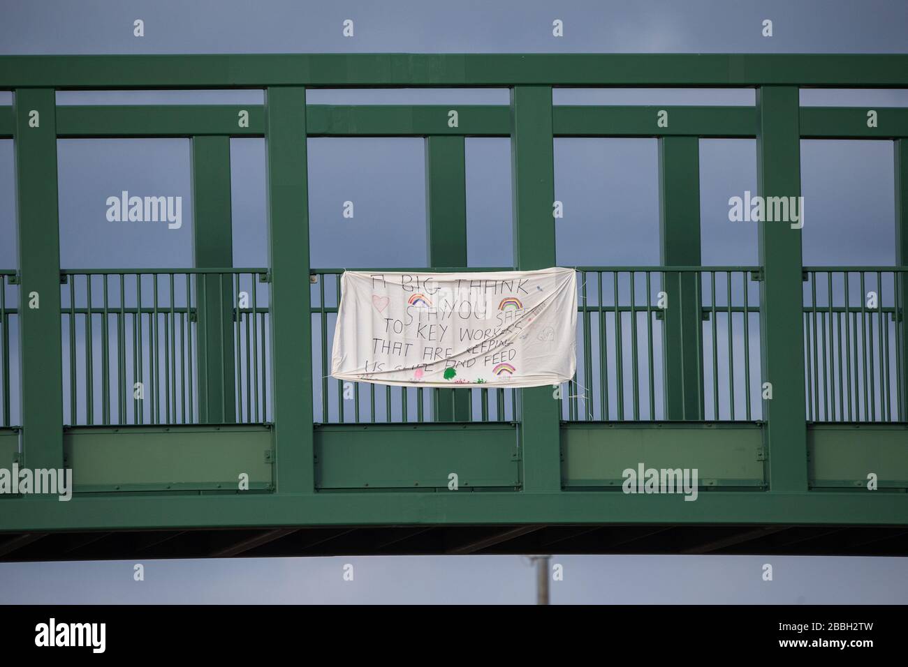Home made sign hanging from pedestrian footbridge hi-res stock ...