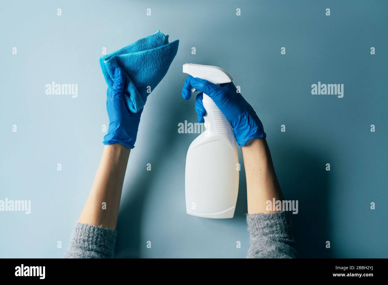 sanitizer and gloved hands Stock Photo - Alamy