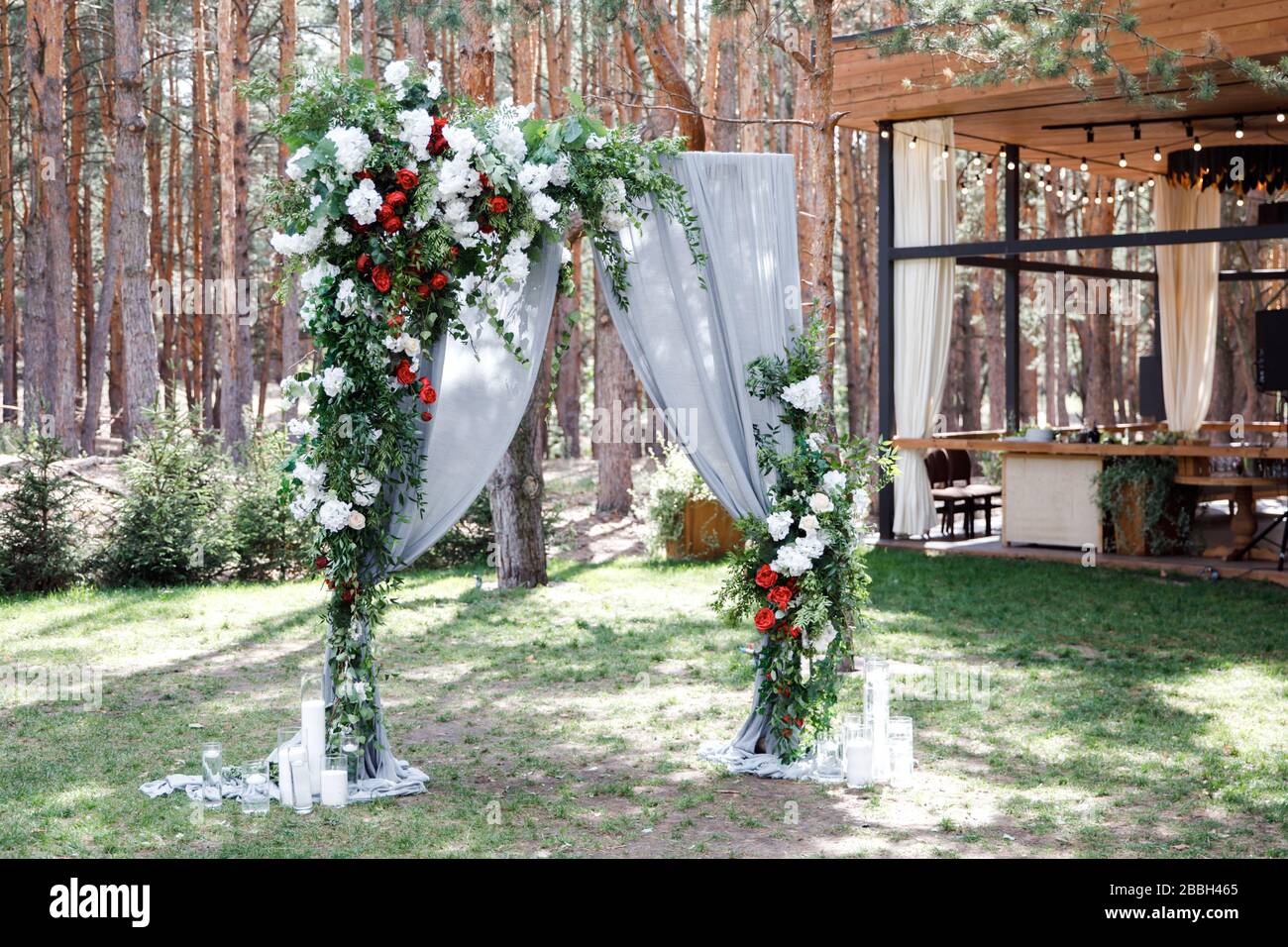 Wedding arch for wedding of newlyweds. Wedding celebration outdoors in ...