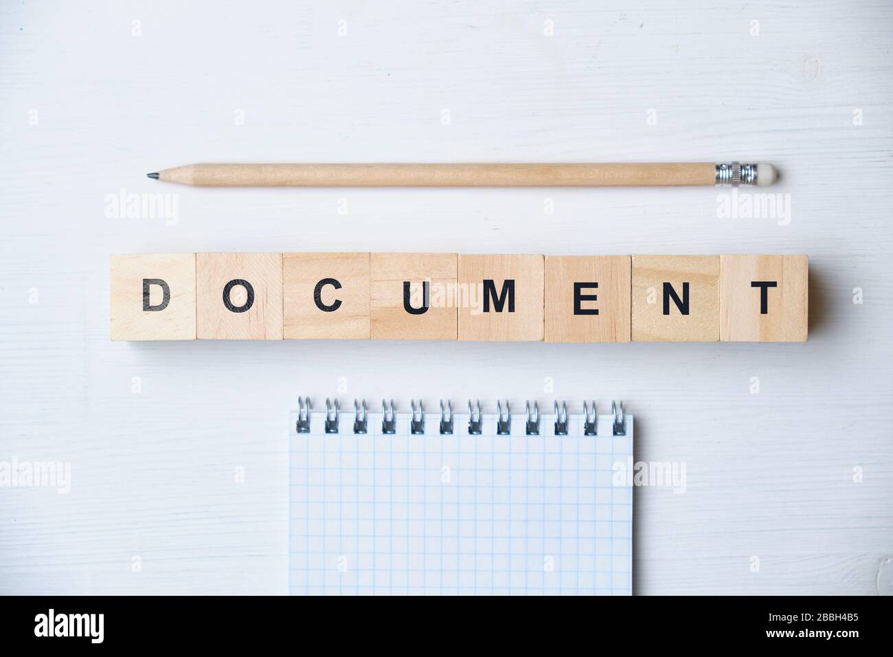 Modern business buzzword - document. Top view on wooden table with ...