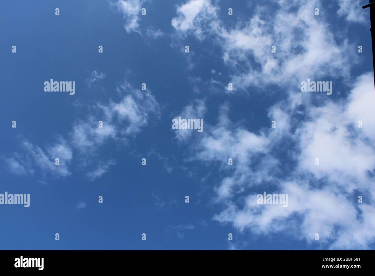 Spring Cloudy Sky with sun Stock Photo - Alamy