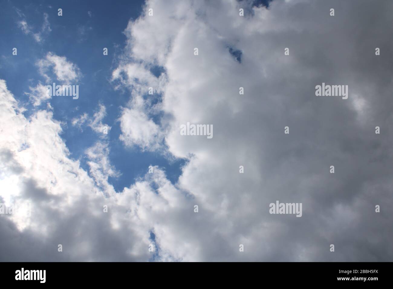 Spring Cloudy Sky with sun Stock Photo - Alamy