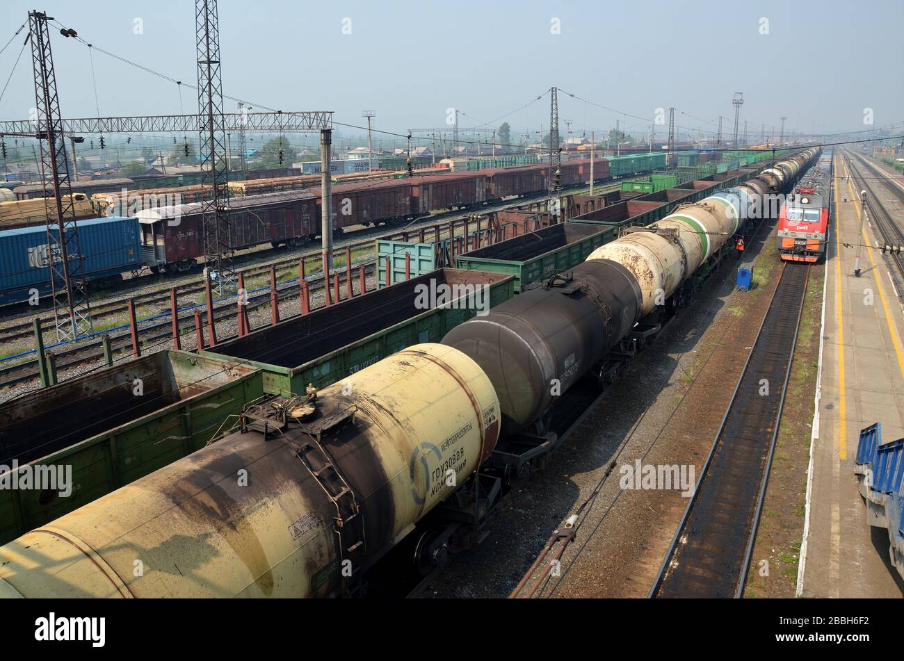 Freight trains on the BAM railway line in the railway sation of ...