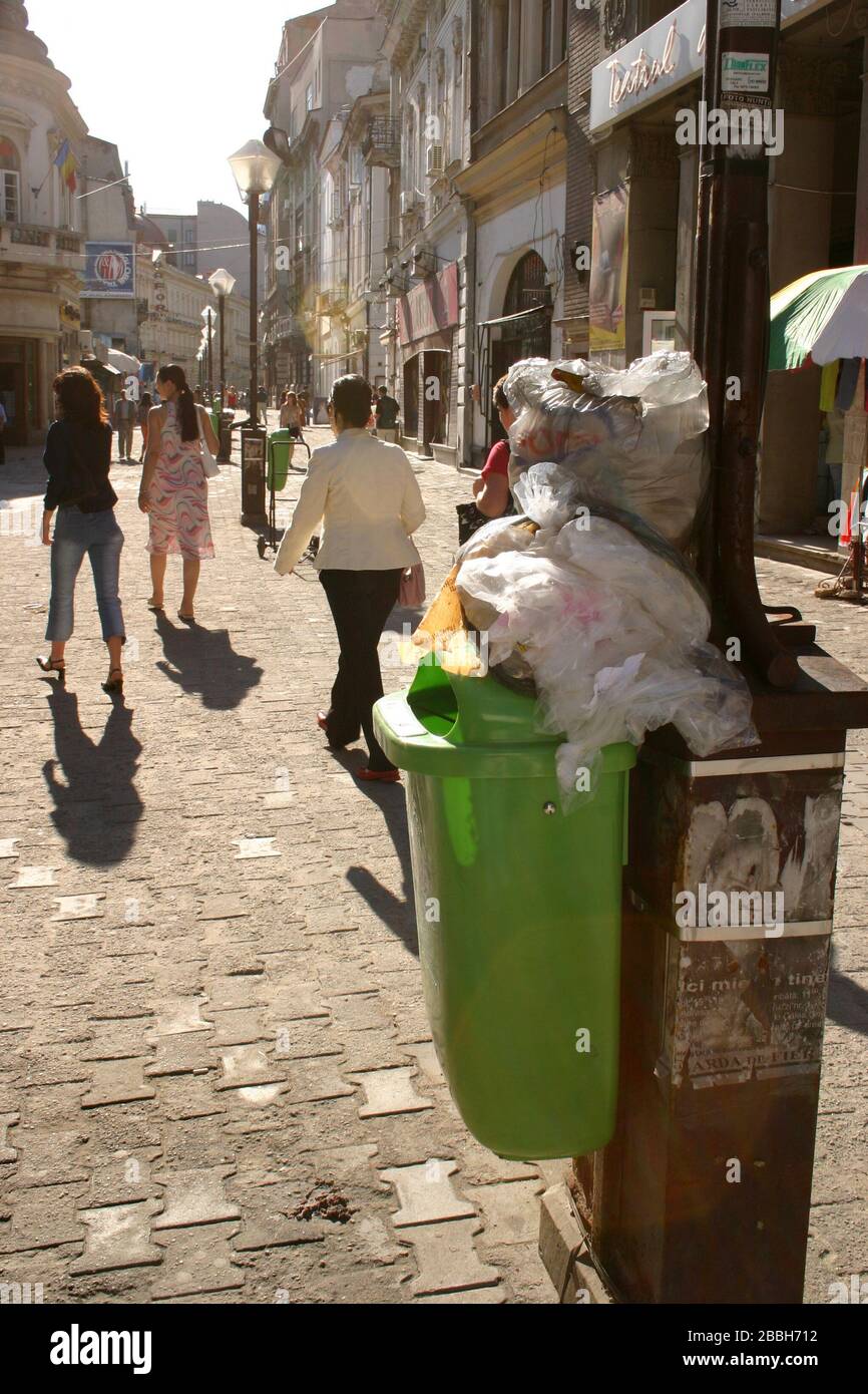 Overflowing trash bin in downtown Bucharest, Romania Stock Photo - Alamy
