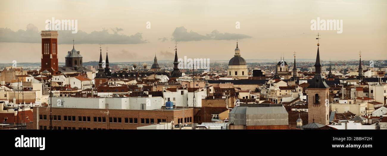 Madrid skyline rooftop view with buildings and church bell tower in ...