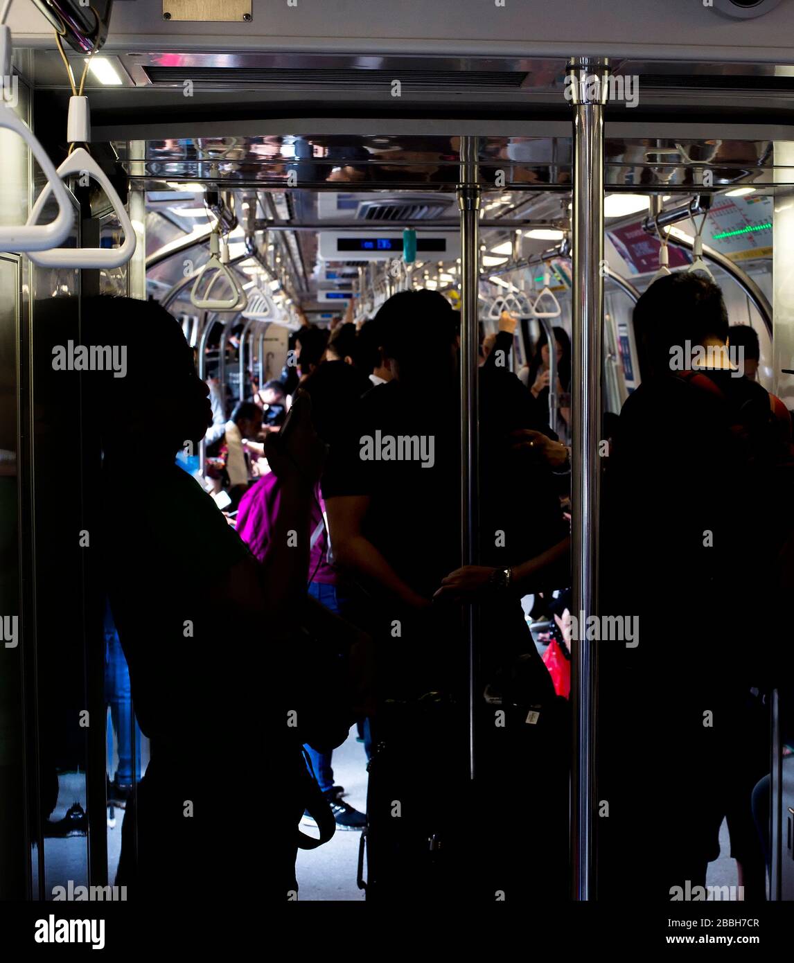 Passengers in Singapore Mass Rapid Transit (MRT) train. The MRT has 102 ...