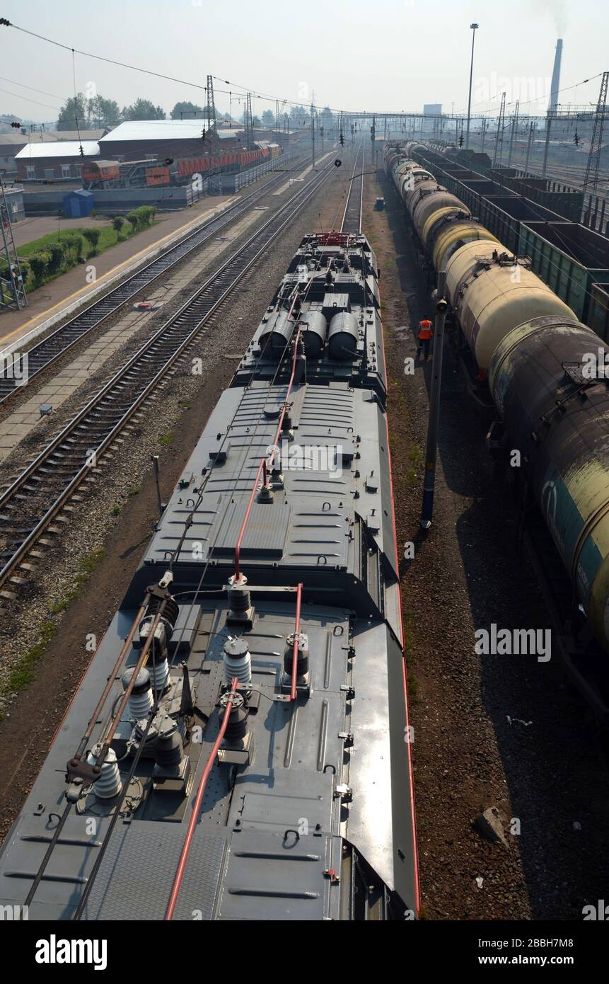 Freight trains on the BAM railway line in the railway sation of ...
