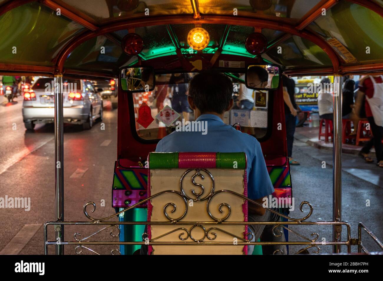 View from the back seat of a Pink Tuk-Tuk in Bangkok Thailand in the ...
