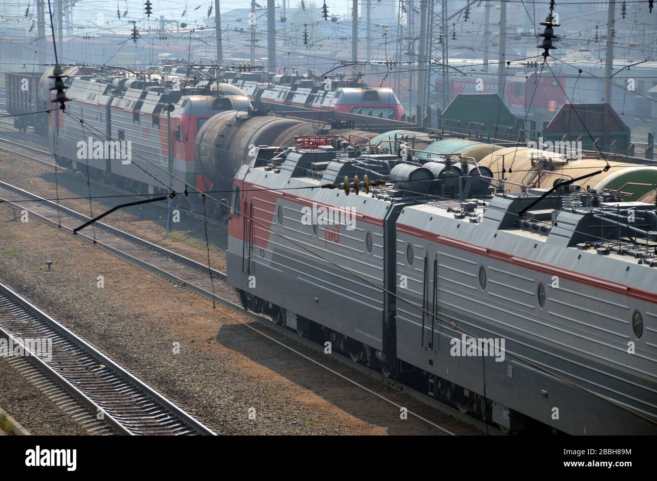 Freight trains on the BAM railway line in the railway sation of ...