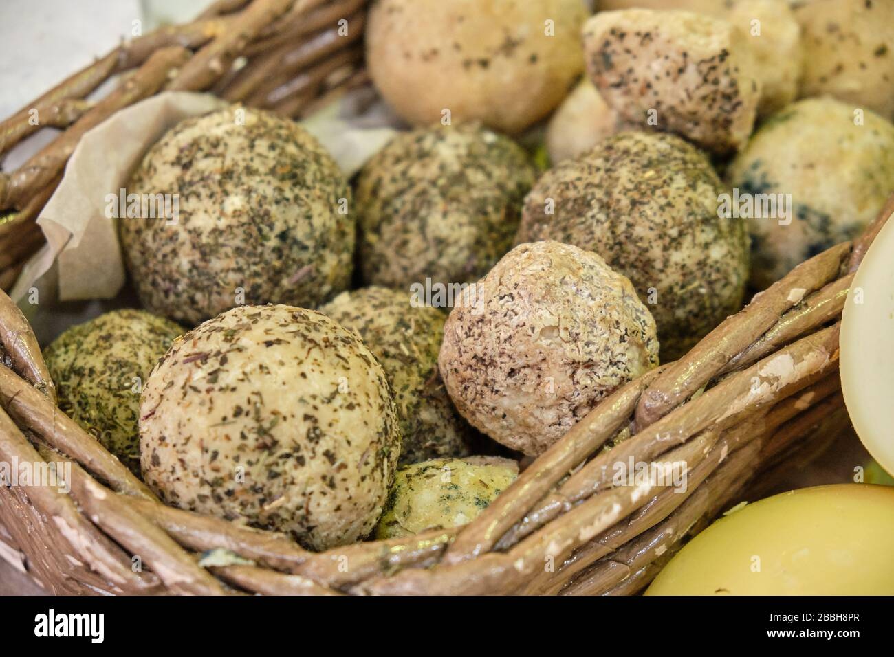 A counter with various types of hand-made cheeses. Close up Stock Photo ...