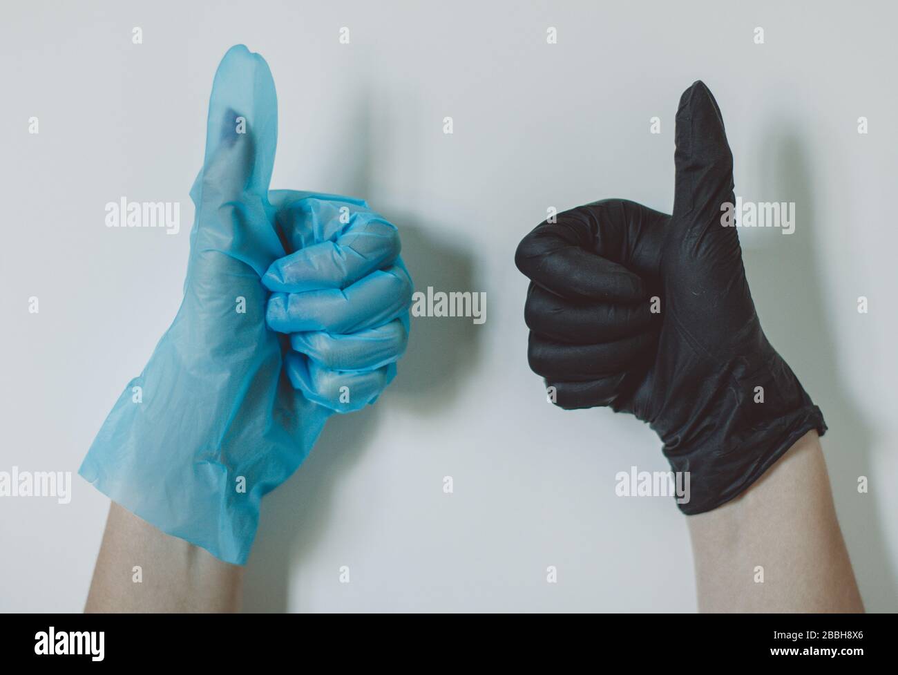 Showing Thumbs Up with Medical Gloves Stock Photo - Alamy