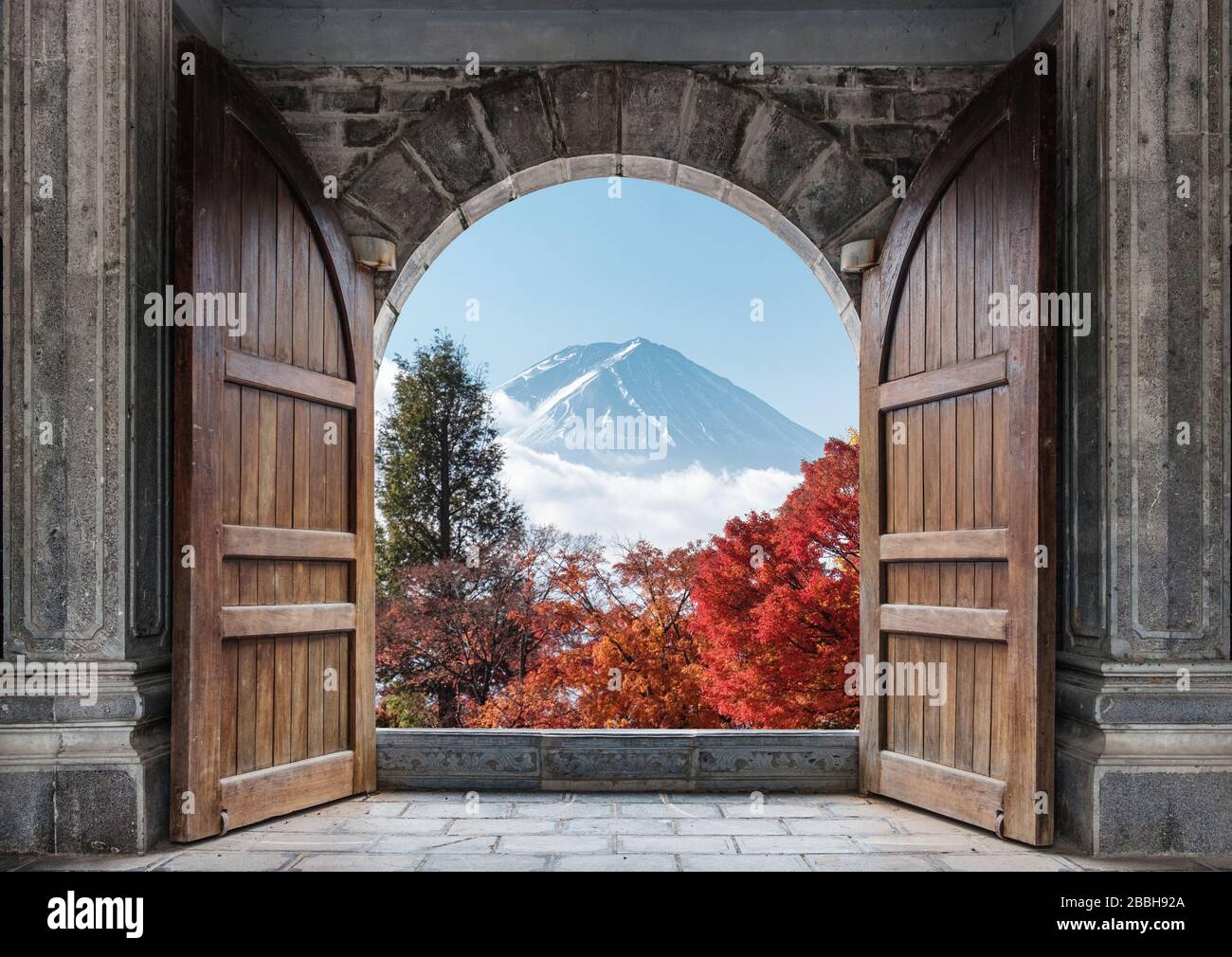 Open large wooden door with mount Fuji-san and autumn maple tree in ...