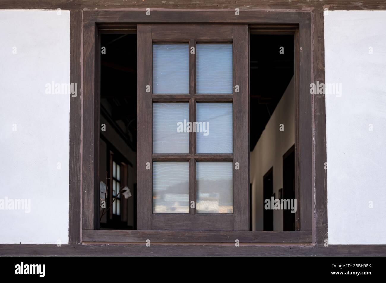 Traditional brown wooden window opened on wall Stock Photo - Alamy