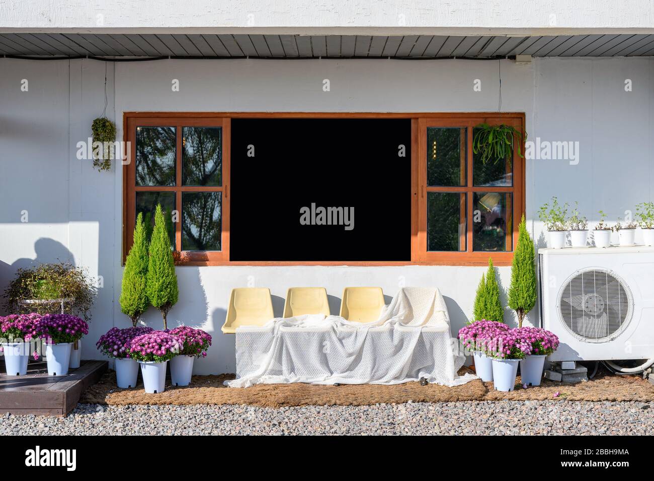 Facade exterior wooden window with seats and ornamental in sunny Stock ...