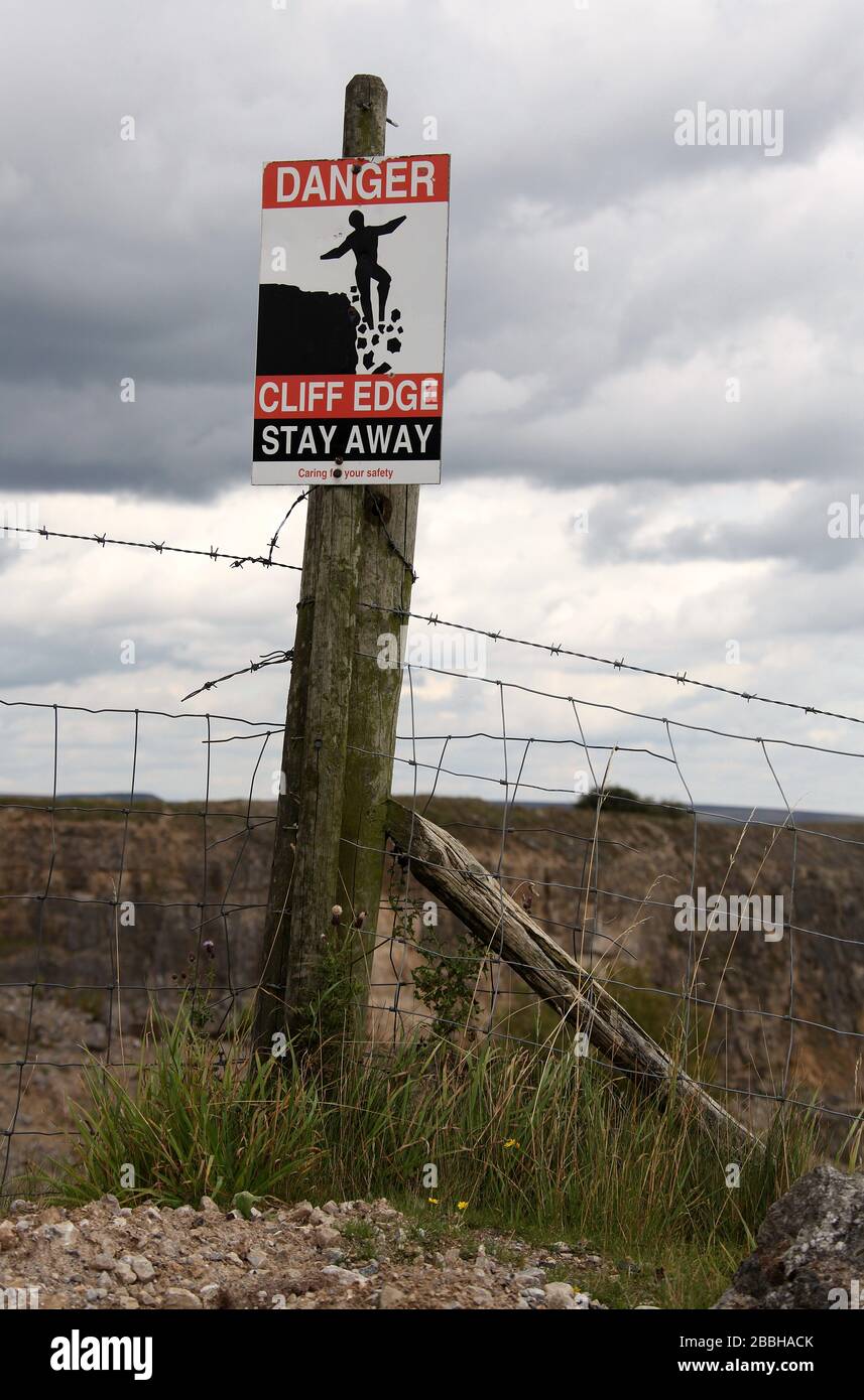 Danger sign at open cast mine workings in the Peak District National ...