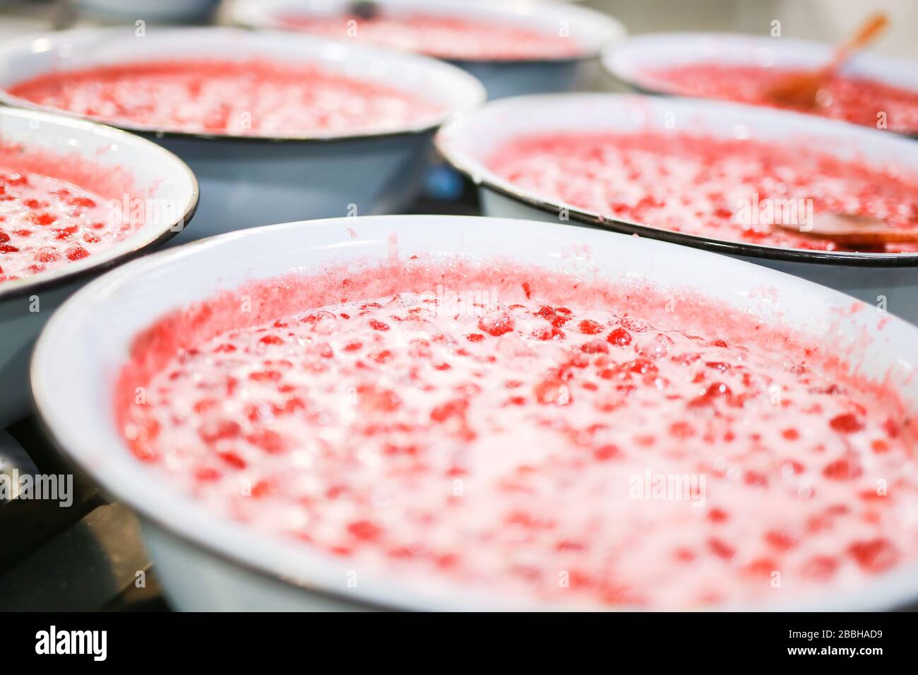 Strawberry jam cooking process. Organic traditional jam manufacturing ...