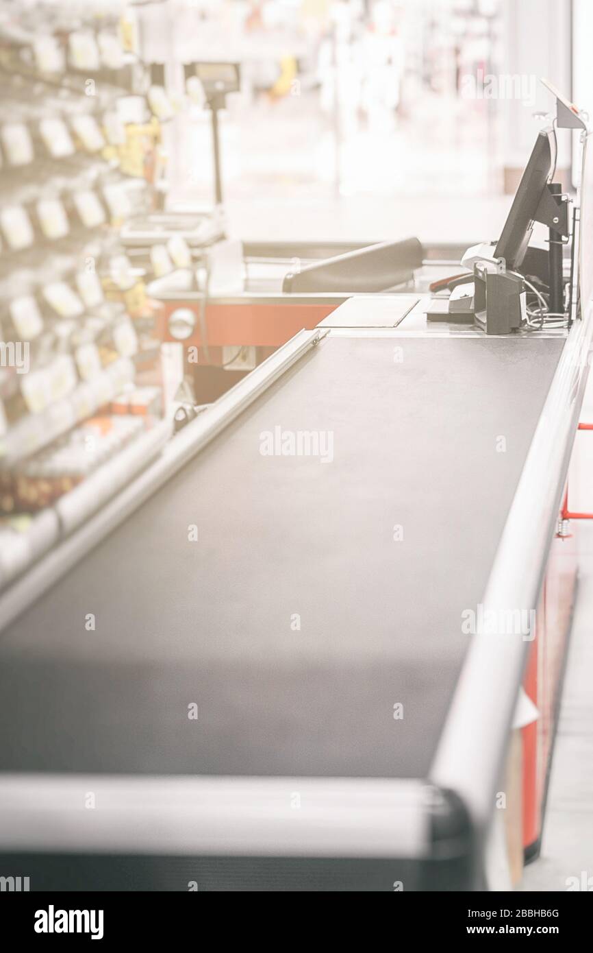 Empty cash desk with closed way border in supermarket Stock Photo - Alamy