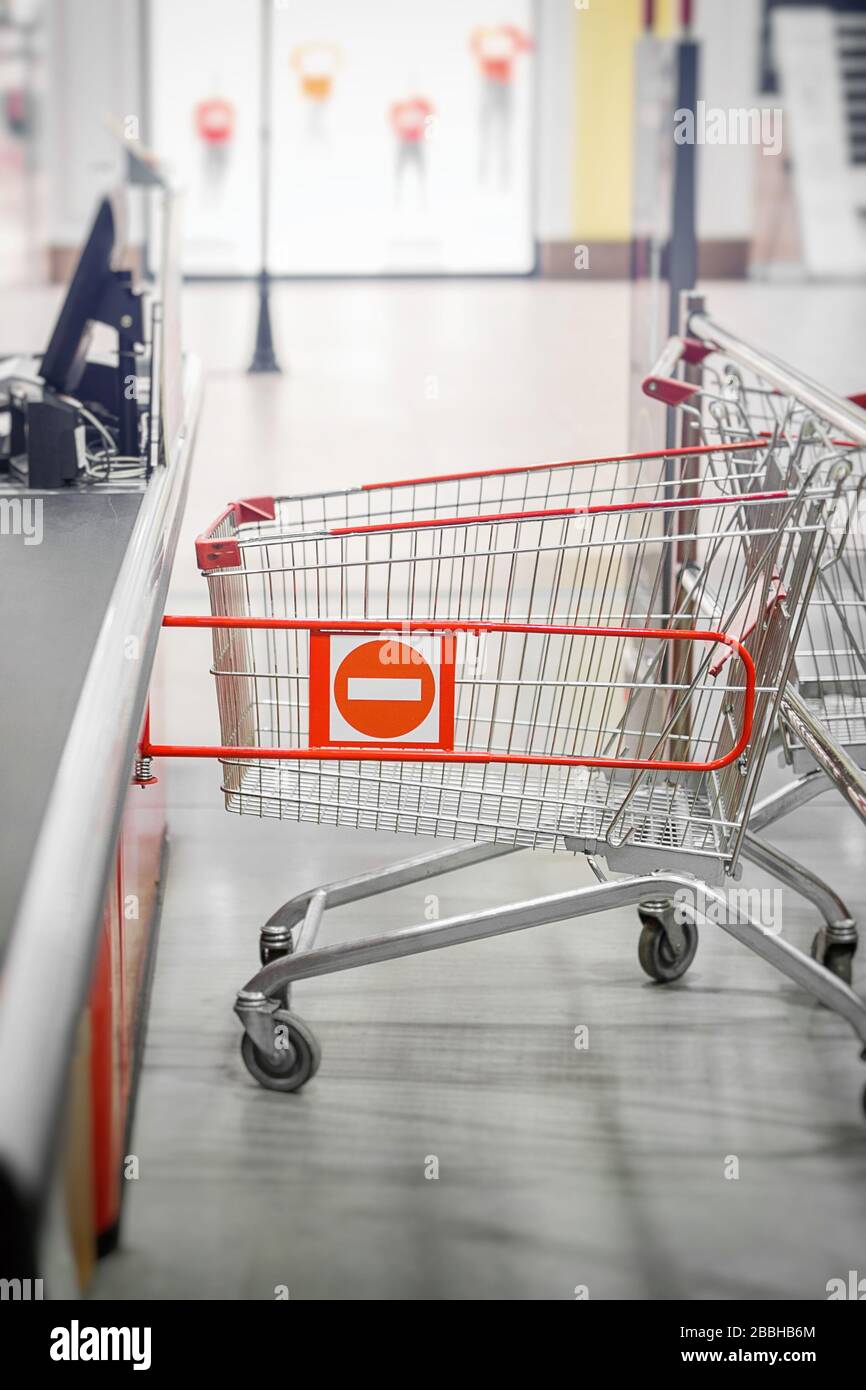 Empty cash desk with closed way border in supermarket Stock Photo - Alamy