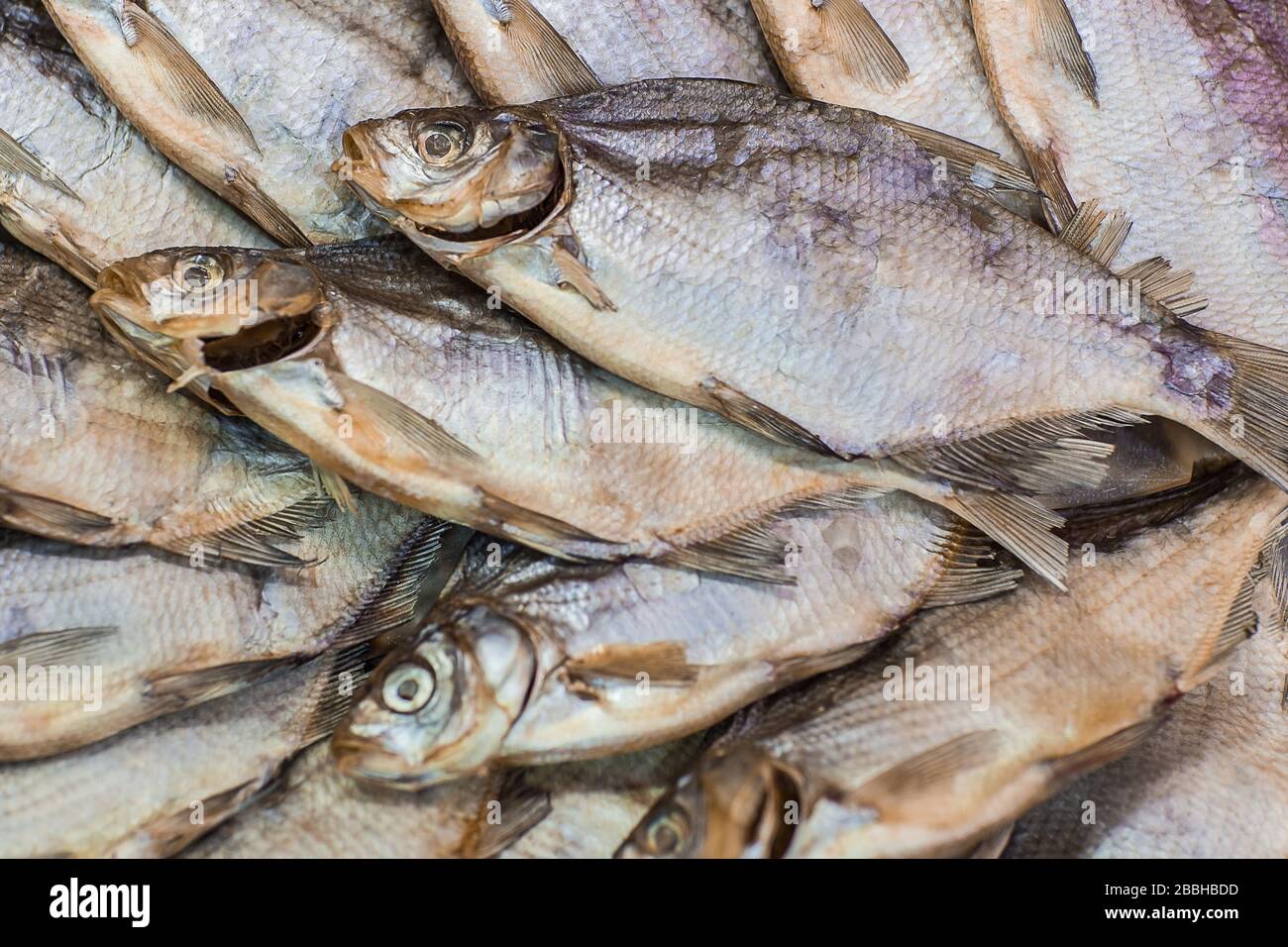 Dried fish background. Salty dry river fish top view with copy space ...