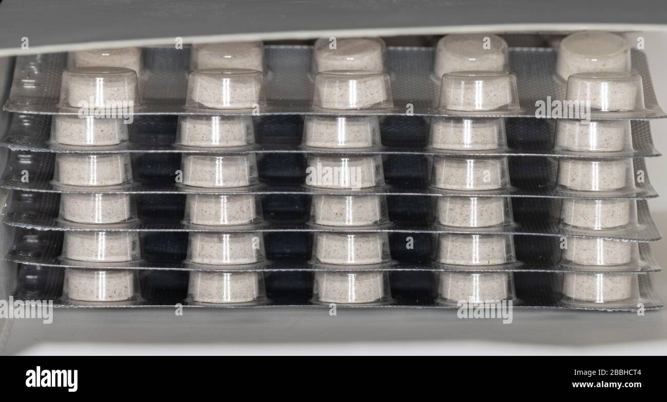 Multiple strips of medication in white cardboard box Stock Photo - Alamy