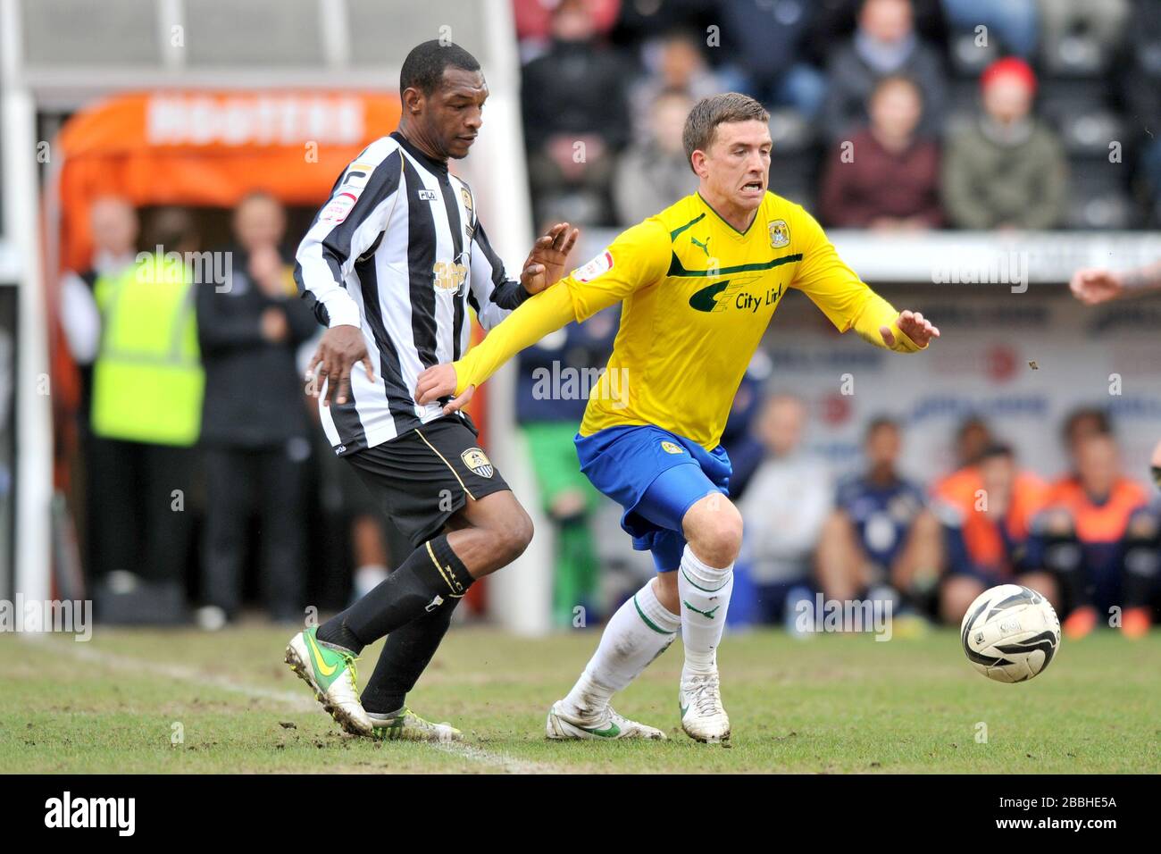 Coventry City's Cody MacDonald battles for the ball with Notts County's ...