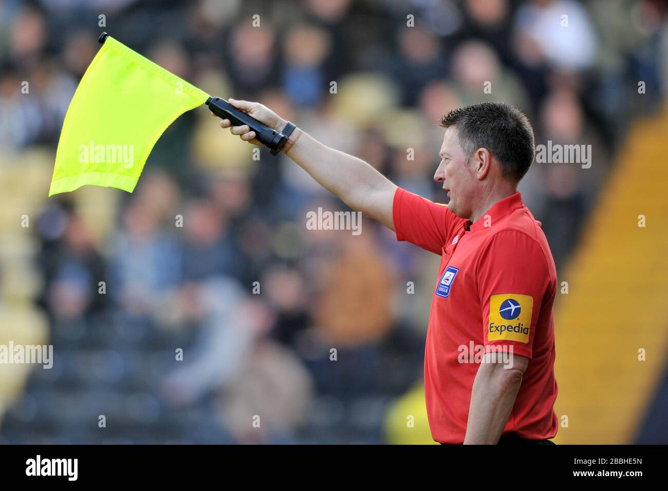 The linesman flags for offside Stock Photo - Alamy