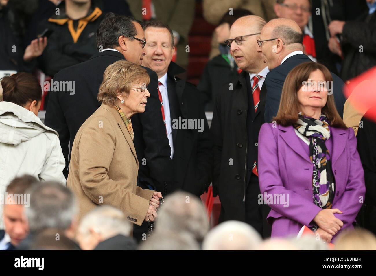 Sir Alex Ferguson's wife Cathy (centre left) walks in front of members ...