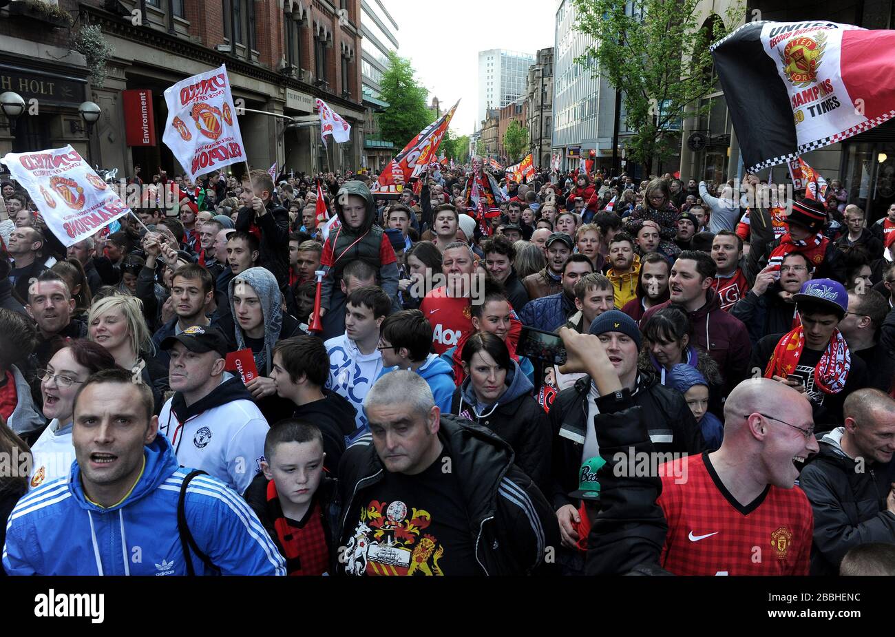 Manchester United fans follow the parade Stock Photo - Alamy