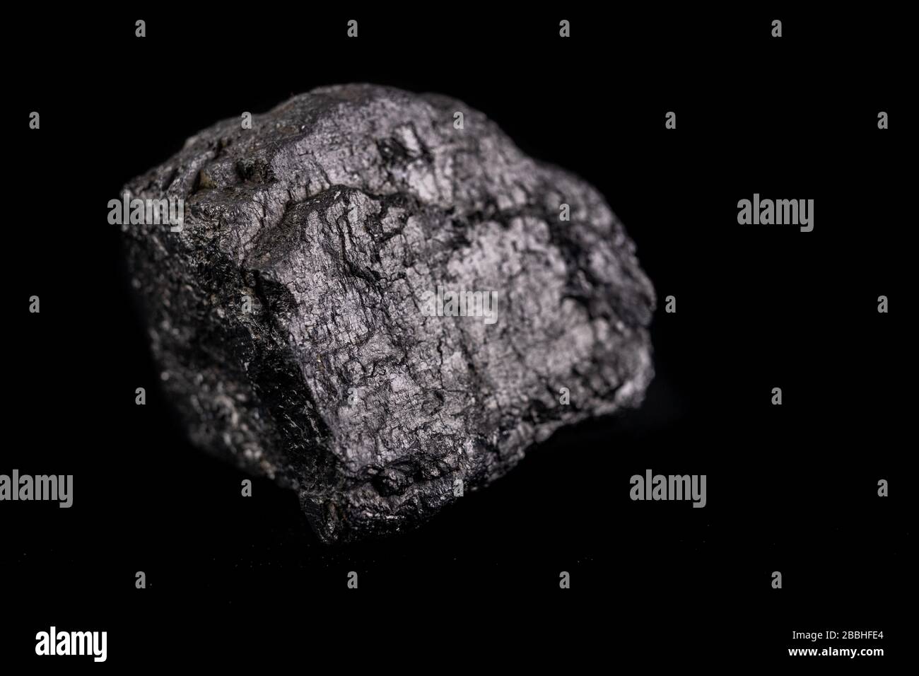 Lignite lump. Carbon as an energy source. Dark background Stock Photo ...