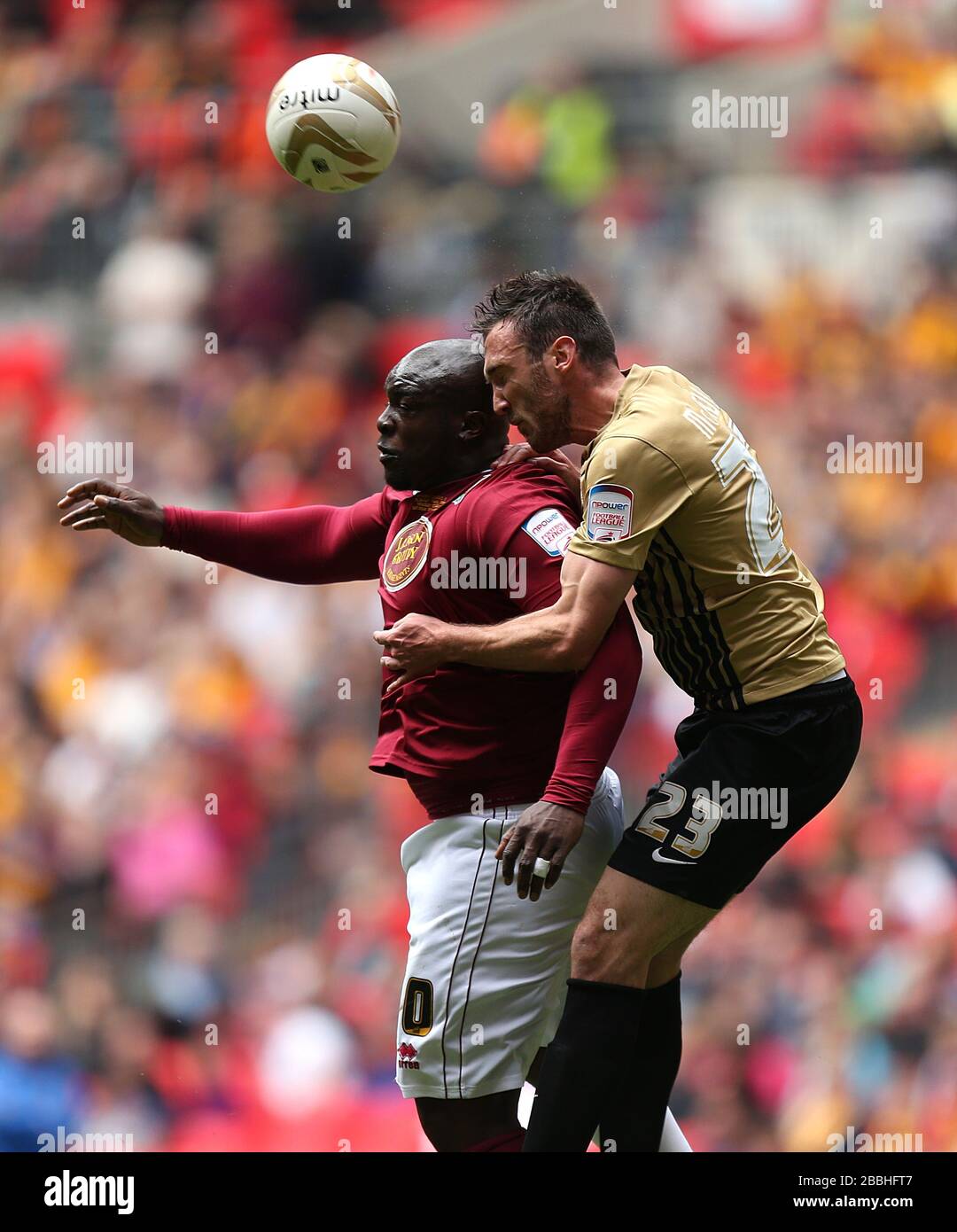Northampton Town's Adebayo Akinfenwa (left) and Bradford City's Rory ...