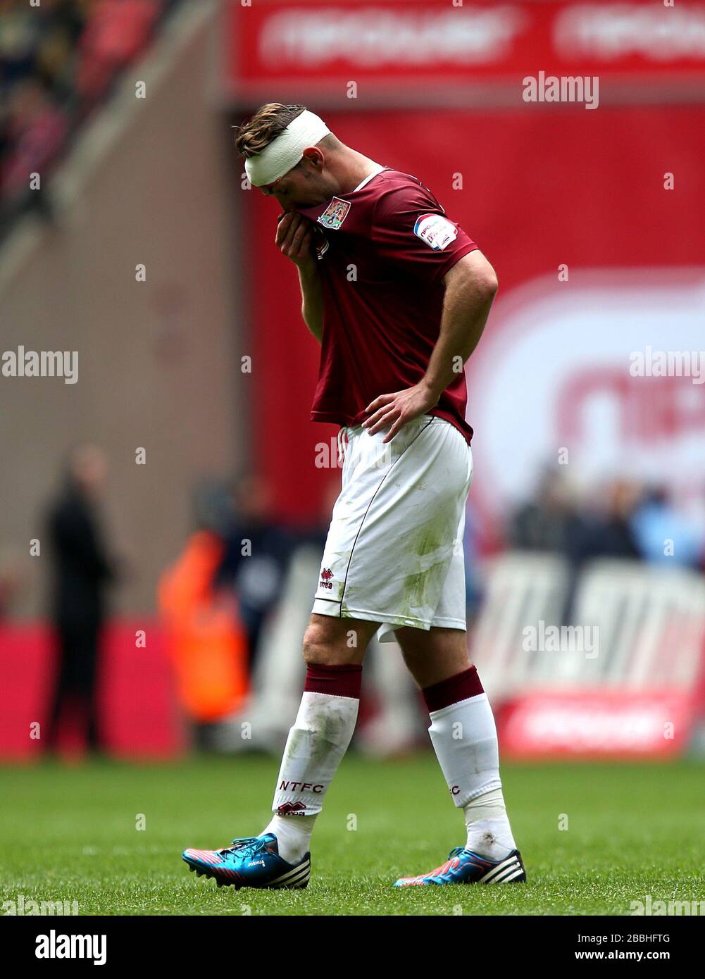Northampton Town's Ben Harding stands dejected after the final whistle ...