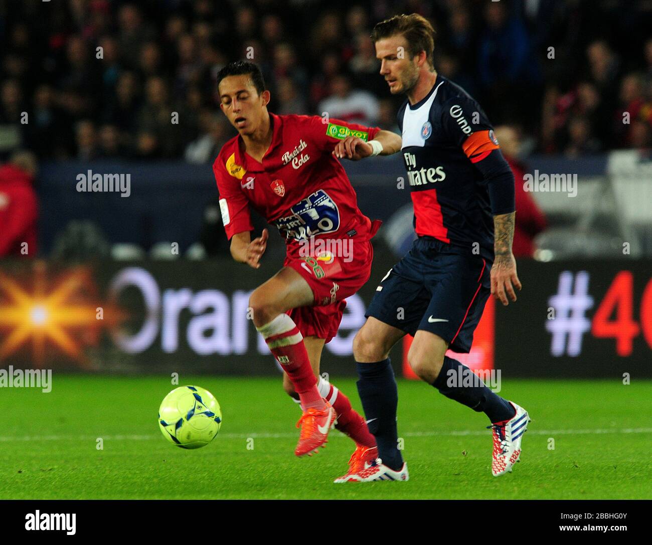 Paris Saint-Germain's David Beckham (right) and Stade Brestois' Kamel ...