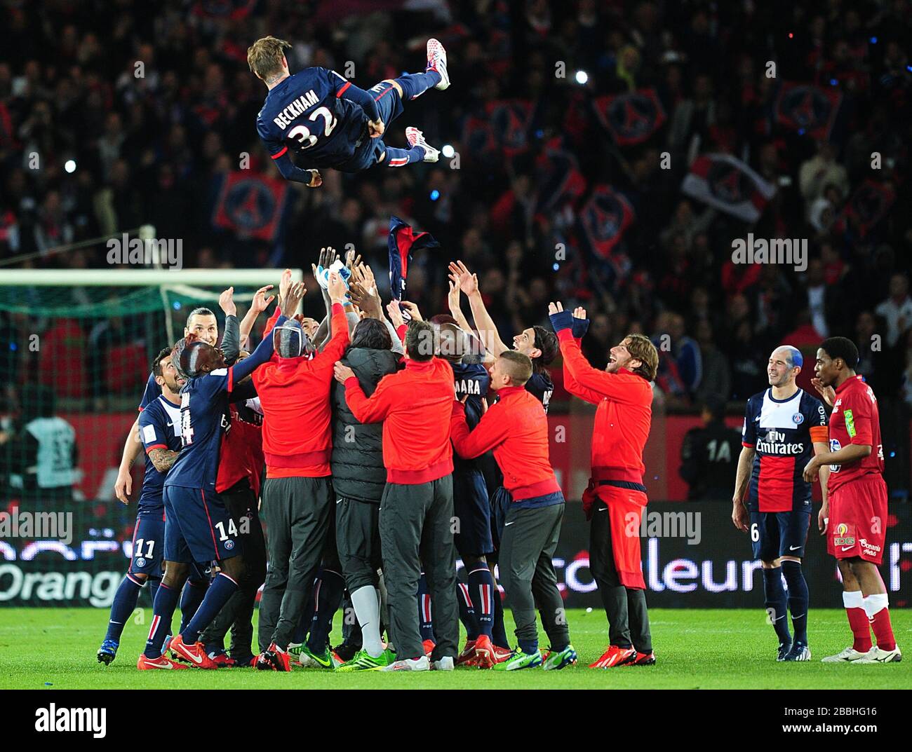 Paris Saint-Germain's throw David Beckham up into the air after the ...