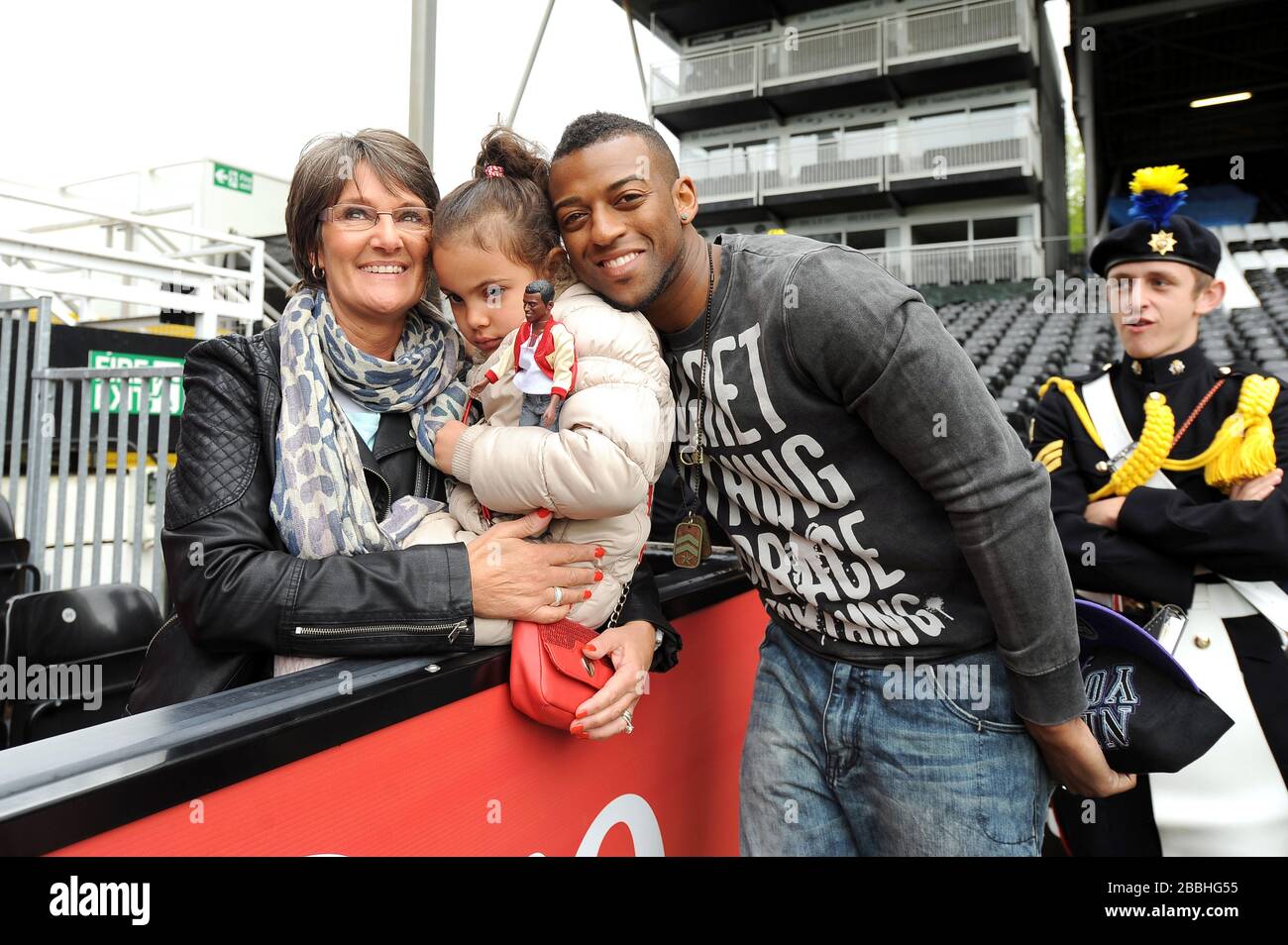 JLS singer Oritse poses for photographs with fans before the game Stock ...