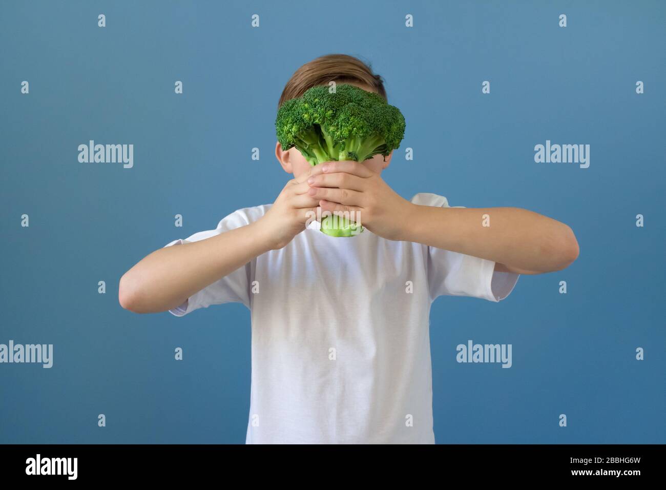 Child boy playing with fresh broccoli. Healthy food Stock Photo - Alamy