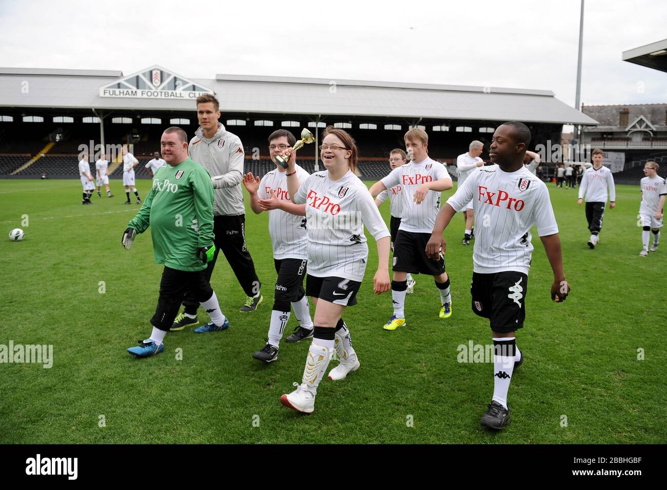 Children celebrate after playing football on the pitch before the ...